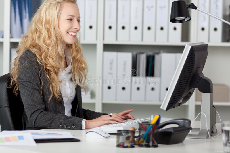 Businesswoman Using Computer at Desk Stock Image - Image of happy ...