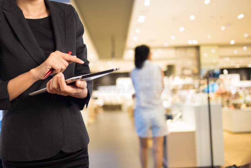 Businesswoman Using Digital Tablet in the Shopping Mall. Stock Image ...