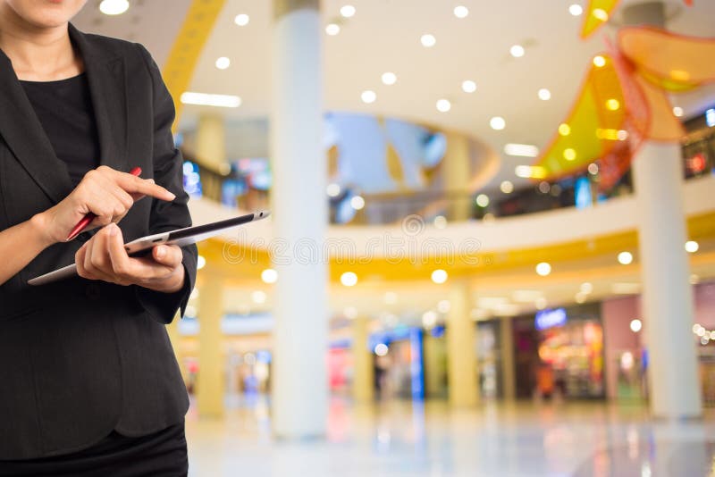 Businesswoman Using Digital Tablet in the Shopping Mall. Stock Image ...