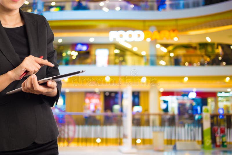 Businesswoman Using Digital Tablet in the Shopping Mall. Stock Photo ...