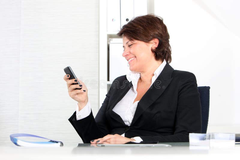 Businesswoman Using Her Mobile at Work Stock Photo - Image of talk ...
