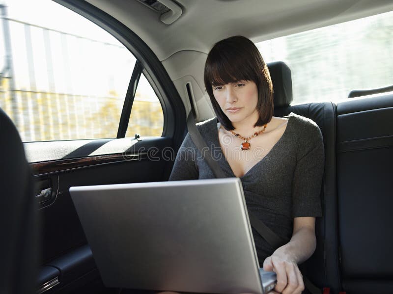 Business Travel: Businesswoman with Laptop in Car Stock Image - Image ...