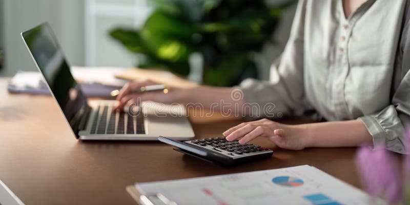 Businesswoman Using Laptop Computer and Working at Office with ...