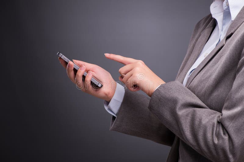 The Businesswoman Using Mobile Phone in Business Concept Stock Photo ... The Businesswoman Using Mobile Phone in Business Concept Stock Photo ...