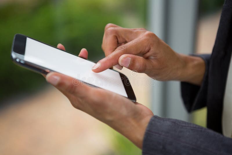 Businesswoman Using Mobile Phone at Conference Centre Stock Image ...