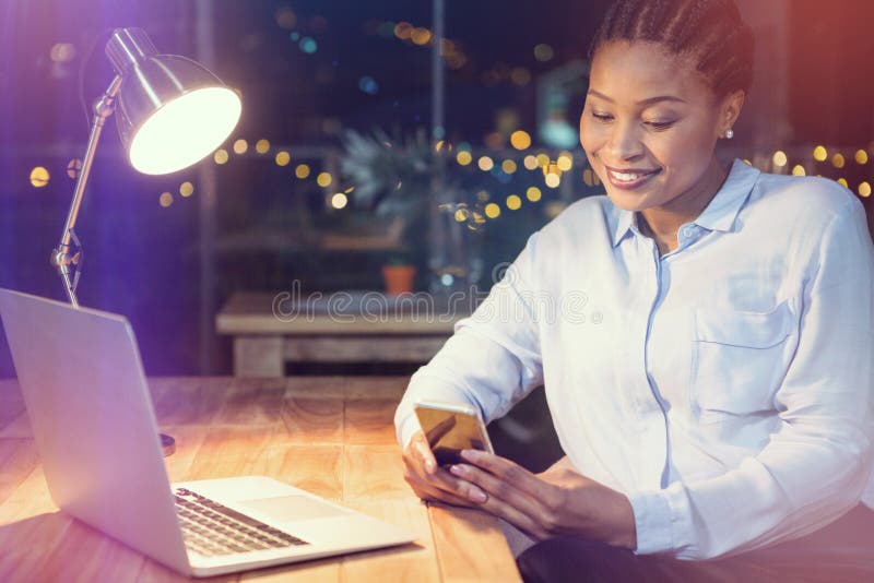 Businesswoman Using Mobile Phone at Desk Stock Image - Image of ...
