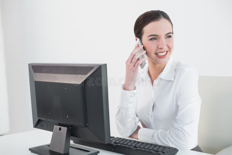 Businesswoman Using Mobile Phone in Front of Computer Stock Image ...