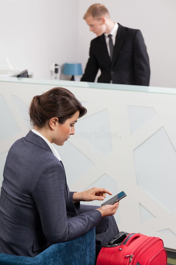 Businesswoman Waiting for Check in Stock Image - Image of elegant ...