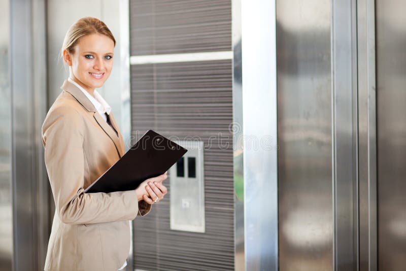 Businesswoman Waiting for Elevator Stock Photo - Image of beauty ...