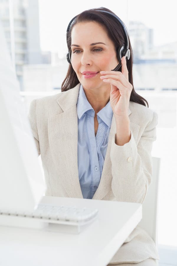 Businesswoman Wearing a Headset Stock Image - Image of interacting ...