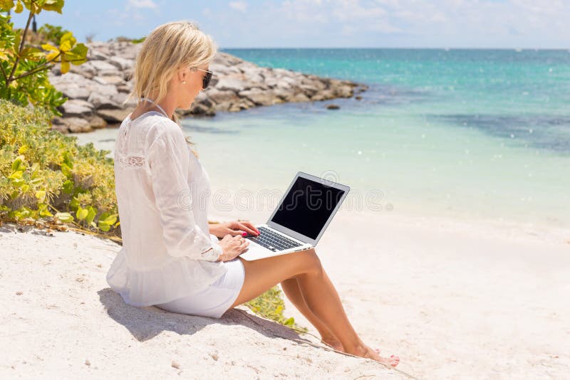 Businesswoman Working with Computer on the Beach Stock Photo - Image of ...