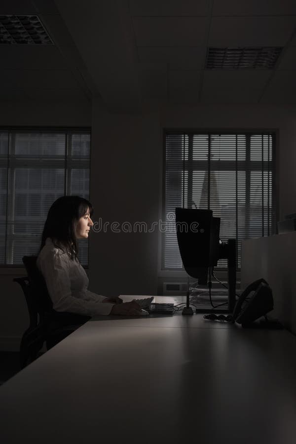 Silhouette of a Woman in a Dark Office Stock Photo - Image of indoors ...