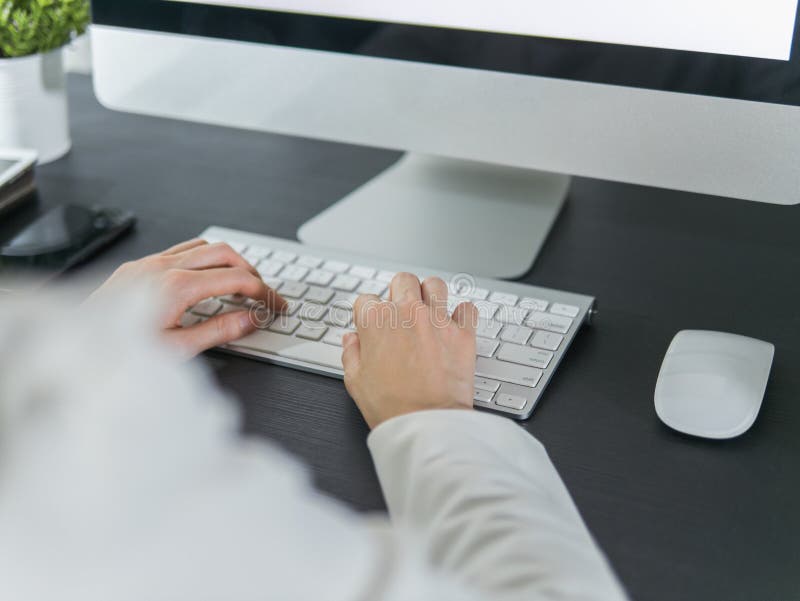 Businesswoman Working on Computer Desktop in Office Stock Photo - Image ...