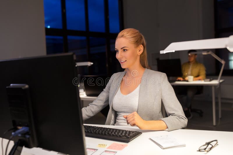 Businesswoman Working on Computer at Night Office Stock Image - Image ...