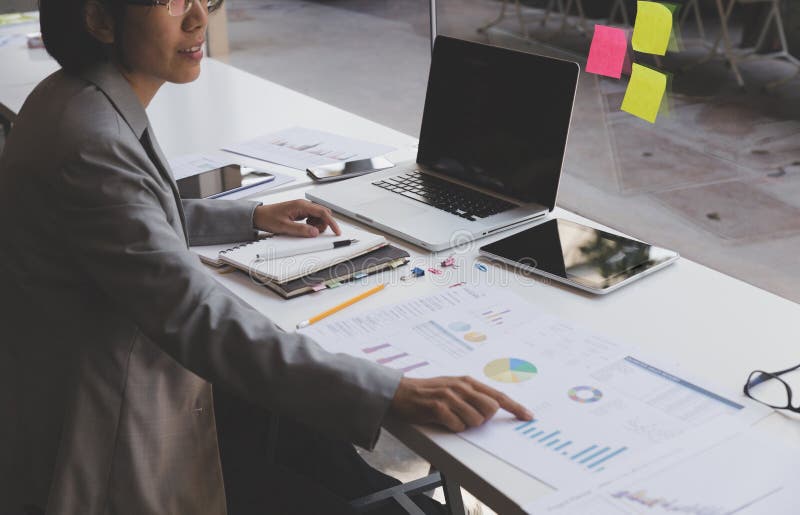 Businesswoman Working with Document and Computer in Office Workplace ...