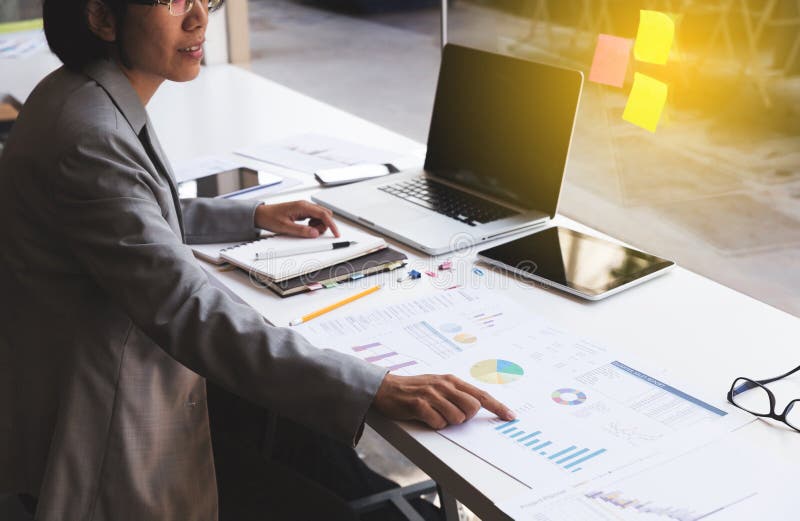 Businesswoman Working with Document and Computer in Office Workplace ...