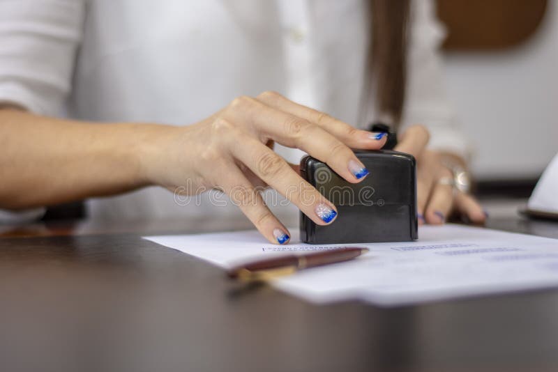 Businesswoman Working on the Documents with a Stamp Stock Image - Image ...
