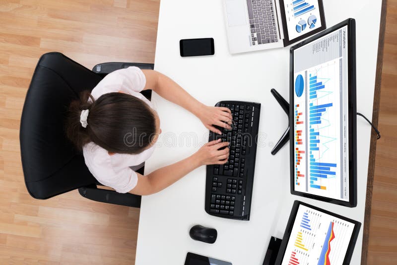 Businesswoman Working with Graphs on Computers Stock Photo - Image of ...