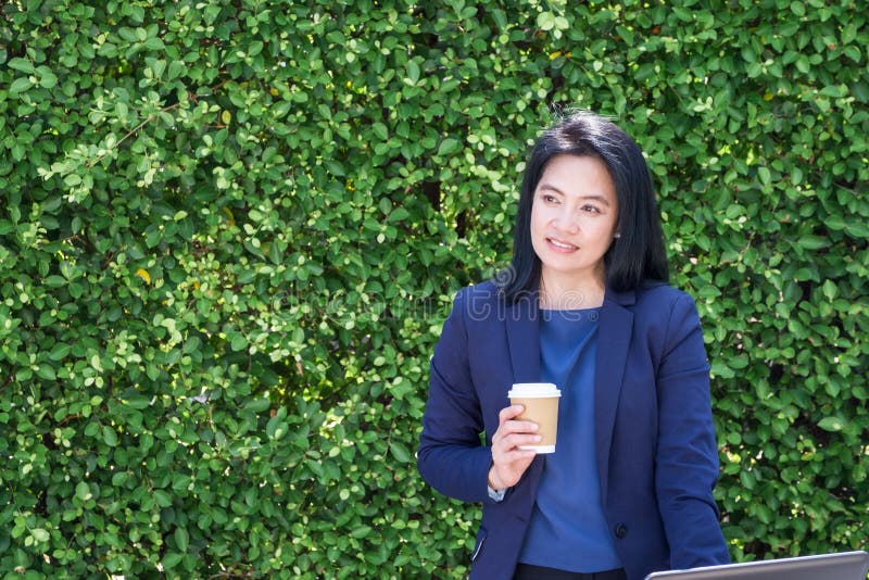 Businesswoman Working Outside Office Green Leaf Wall,business on Stock ...
