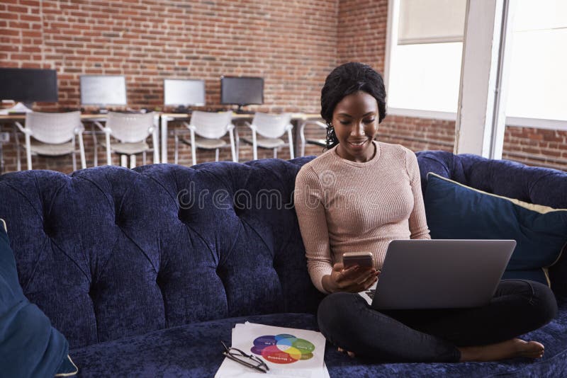 Businesswoman Working on Sofa in Modern Creative Office Stock Photo ...