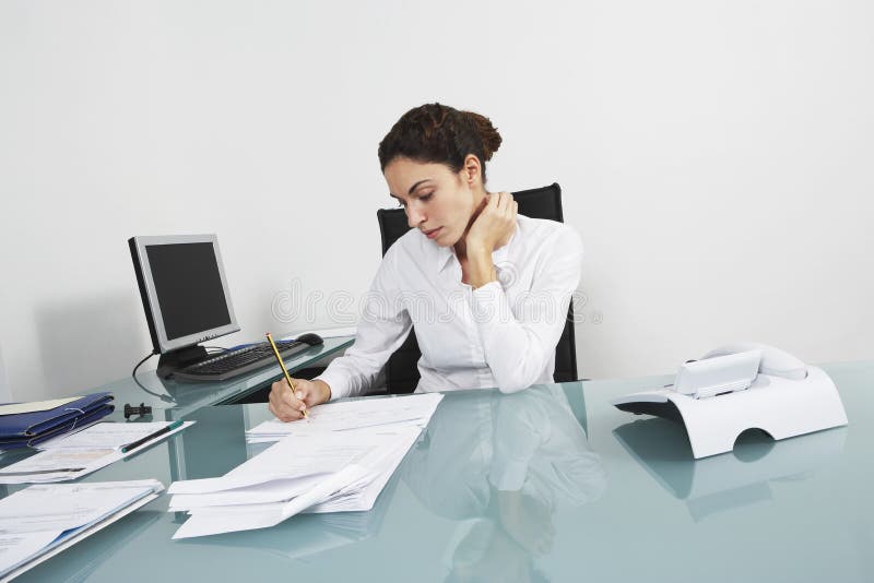 Businesswoman Writing on Document at Office Desk Stock Photo - Image of ...