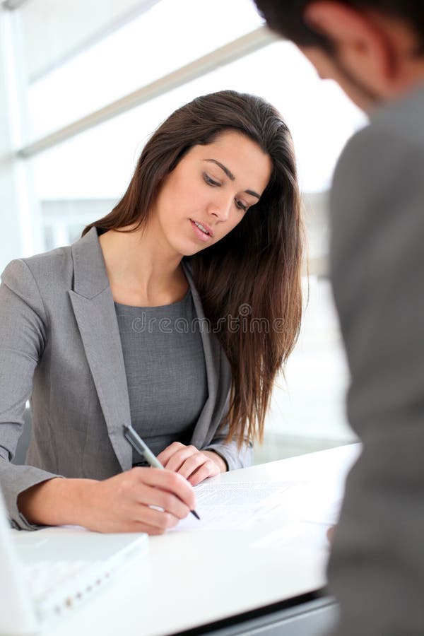 Businesswoman Writing a Document for Partner Stock Image - Image of ...