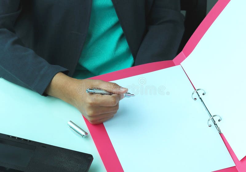 Businesswoman Writing on Folder Stock Photo - Image of learning, form ...