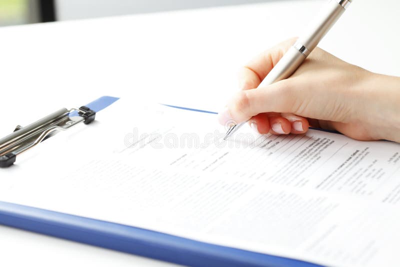 Hand with Pen Signing Form by Green Folder Stock Image - Image of ...