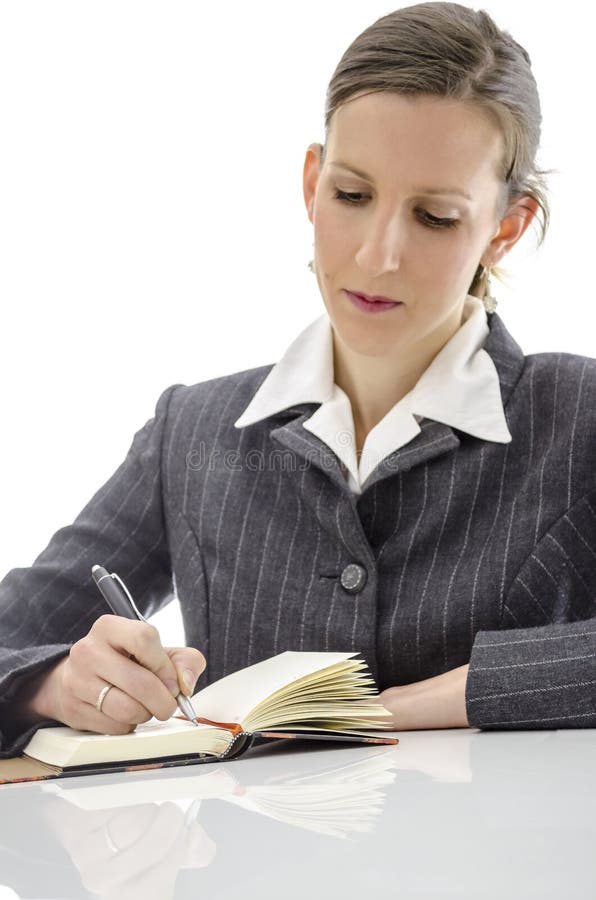 Businesswoman Writing in Her Notepad Stock Image - Image of secretary ...