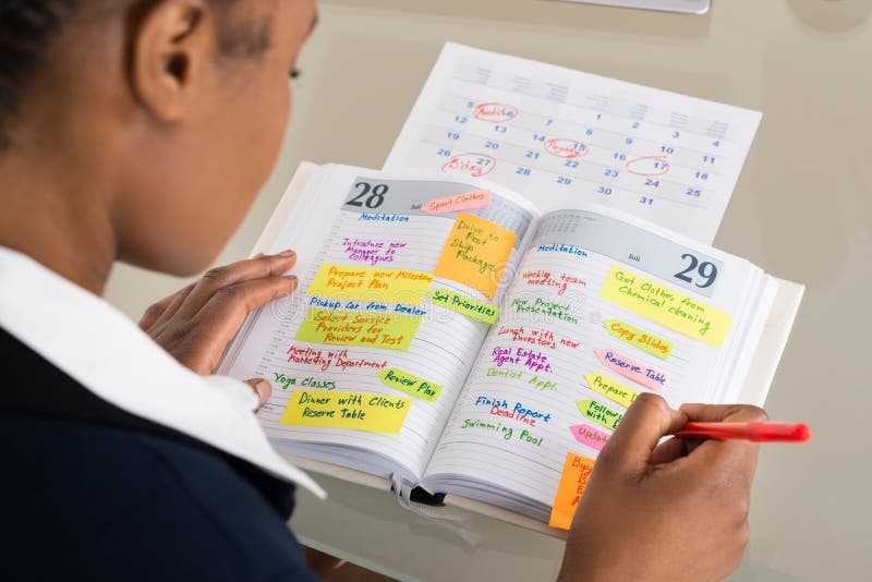 Businesswoman Writing Schedule in Diary Stock Photo - Image of desk ... Businesswoman Writing Schedule in Diary Stock Photo - Image of desk ...
