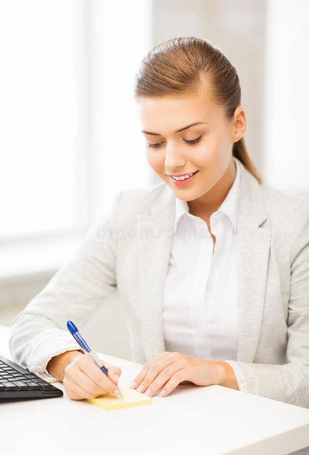 Businesswoman Writing on Sticky Note Stock Photo - Image of girl, paper ...