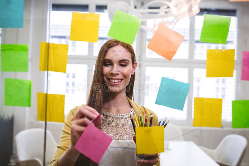 Businesswoman Writing on Sticky Notes Stock Image - Image of beautiful ...