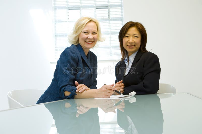 Three Businesswomen at Desk Stock Photo - Image of asian, meeting: 5621036
