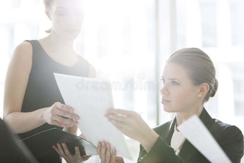 Businesswomen Doing Paperwork in Office Stock Image - Image of indoors ...