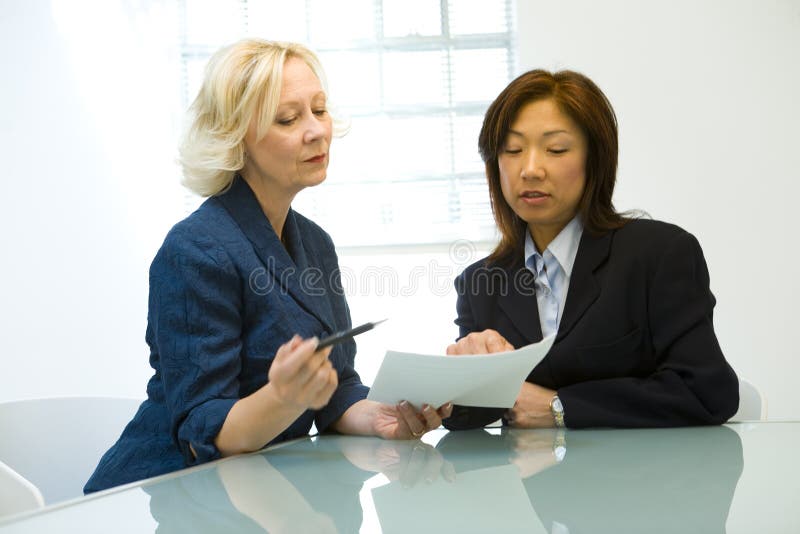 Two women talking business stock photo. Image of attractive - 5621060