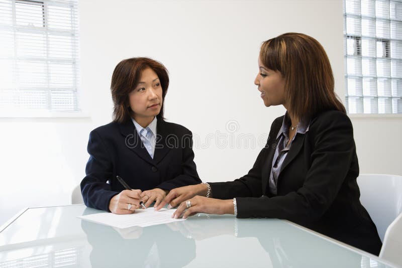Two women talking business stock photo. Image of attractive - 5621060