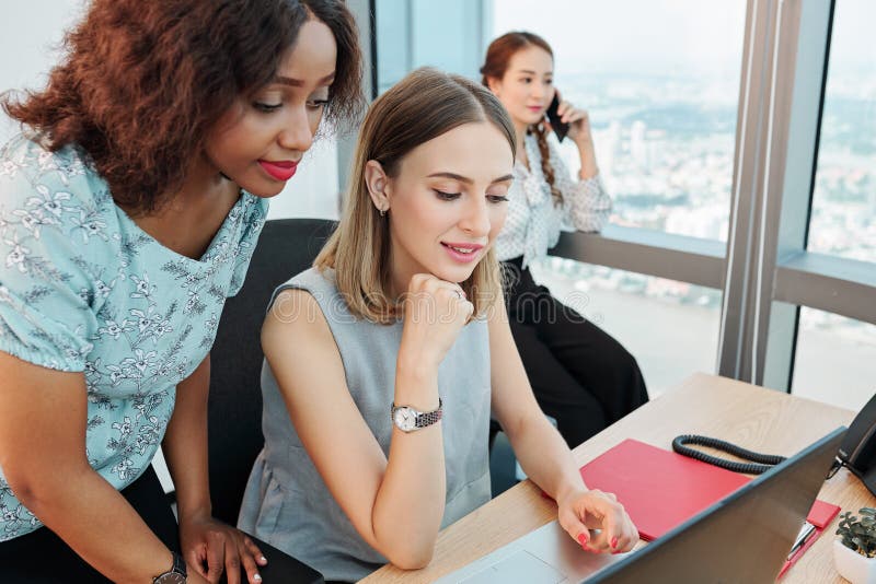 Businesswomen Reading E-mail from Client Stock Photo - Image of adult ...