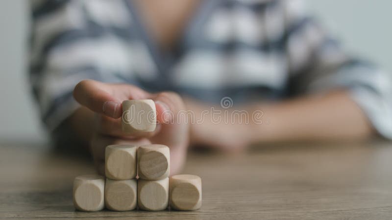 Businesswomen Stack Blank Wooden Cubes on the Table with Copy Space ...