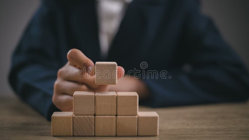 Businesswomen Stack Blank Wooden Cubes on the Table with Copy Space ...