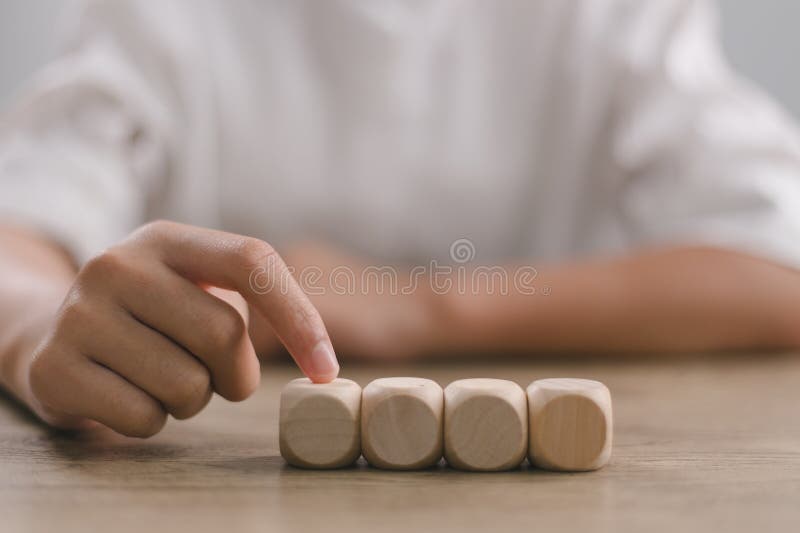 Businesswomen Stack Blank Wooden Cubes on the Table with Copy Space ...