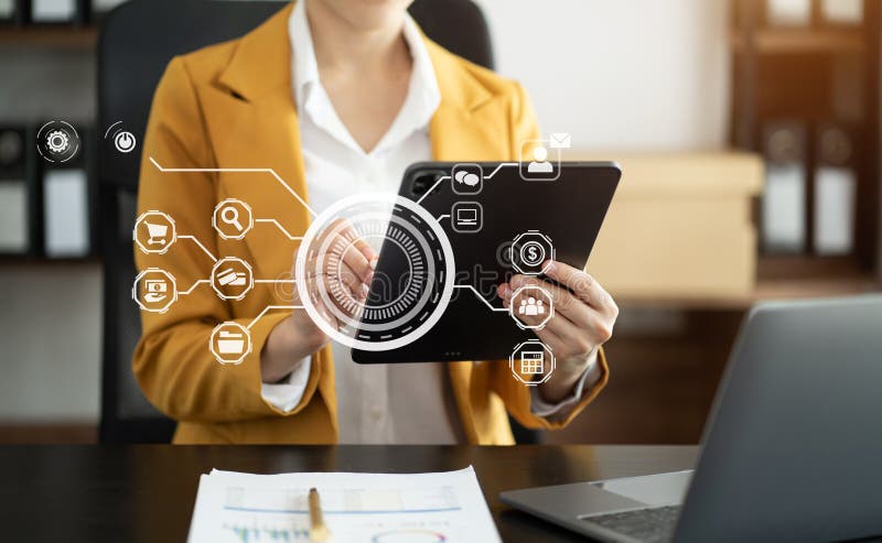 Businesswomen Using Tablet with Laptop and Document on Desk in Modern ...