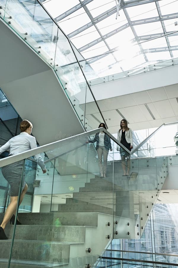 Businesswomen Walking on Steps in Office Stock Image - Image of office ...