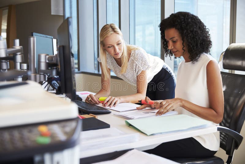 Businesswomen Working at Office Desk on Computer Together Stock Photo ...