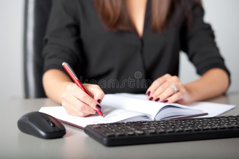 Woman writing at desk stock image. Image of holding, detail - 9886723