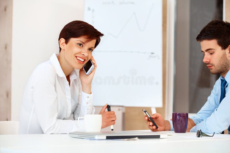 Bussiness People Using Cell Phones in a Office Stock Photo - Image of ...