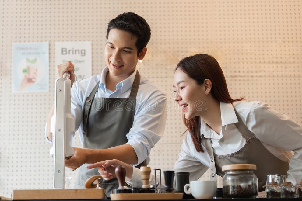 Training in Coffee Mastery. a Barista Demonstrating Brewing Techniques ...
