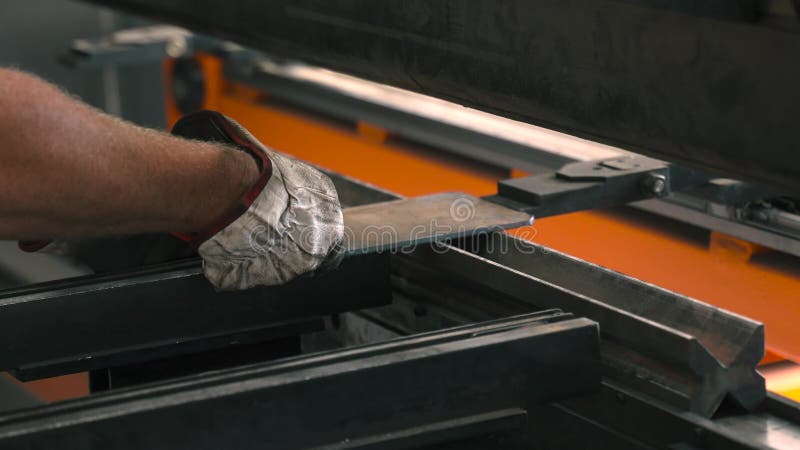 Metal Bending Machine Operator Expertly Shapes Sheet Metal in Workshop ...
