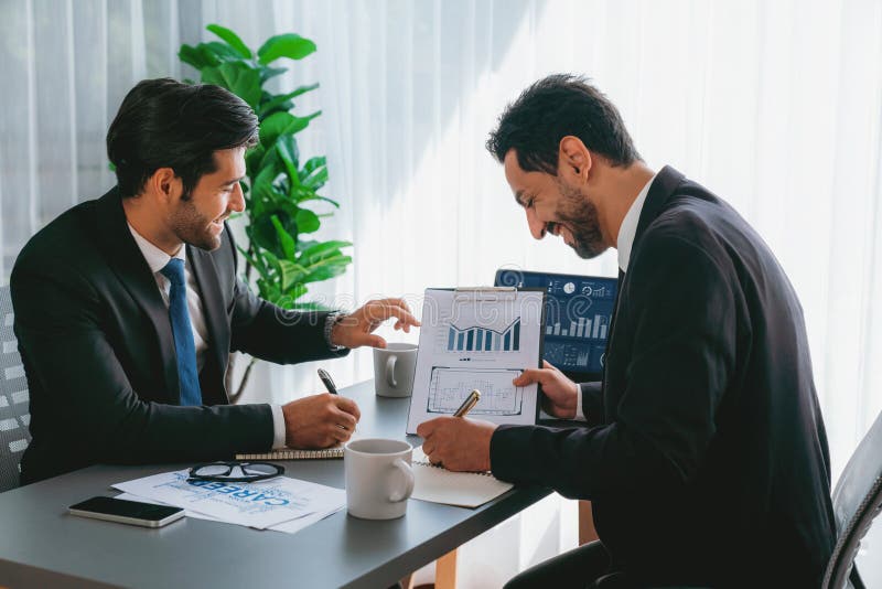Busy Analyst Team Discussing Financial Data on Laptop. Fervent Stock ...