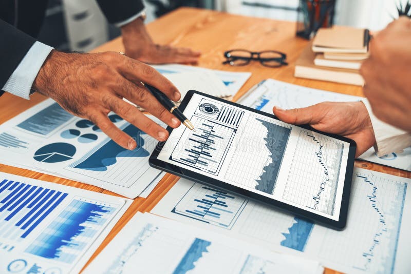 Busy Analyst Team Discussing Financial Data on Laptop. Fervent Stock ...