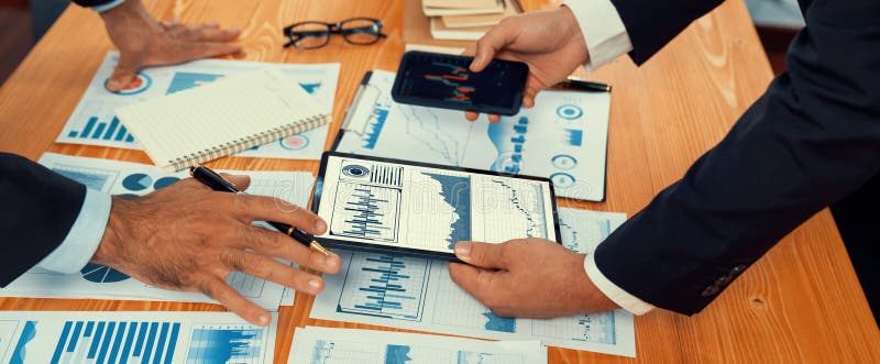 Busy Analyst Team Discussing Financial Data on Tablet. Fervent Stock ...